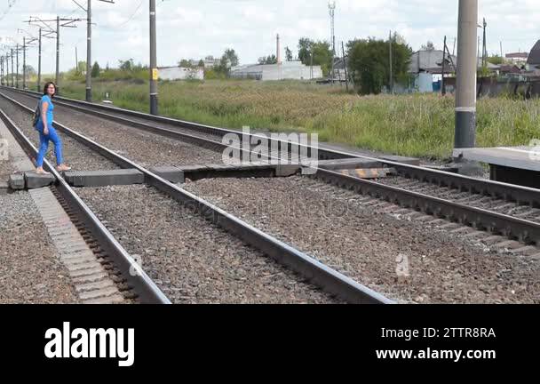 Woman railroad tracks woman crossing Stock Videos & Footage - HD and 4K ...