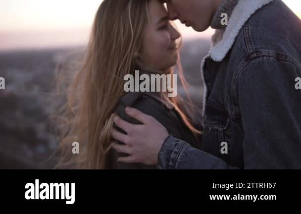 Beautiful,romantic young couple standing face to face while standing on ...