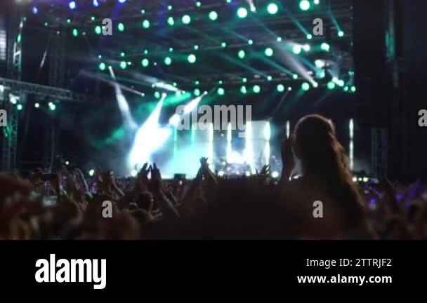 Crazy crowd clapping hands and chanting, greeting their music idols on ...