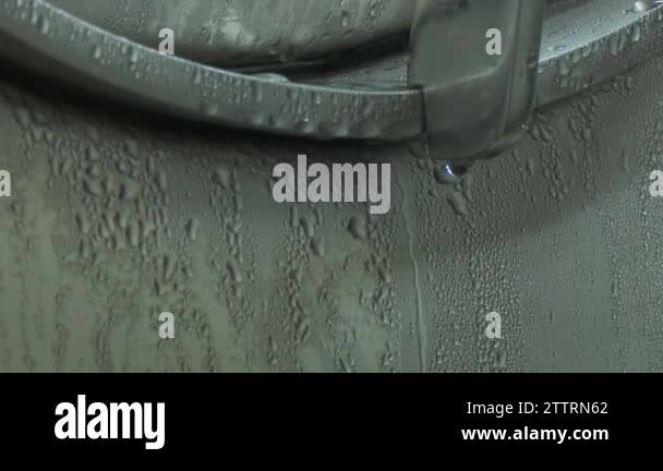 Condensate drops on a metal tank close-up. Steel, modern, shiny ...