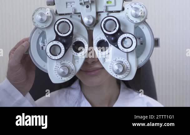 Young woman eyes examination at optometrist ophthalmologist using ...