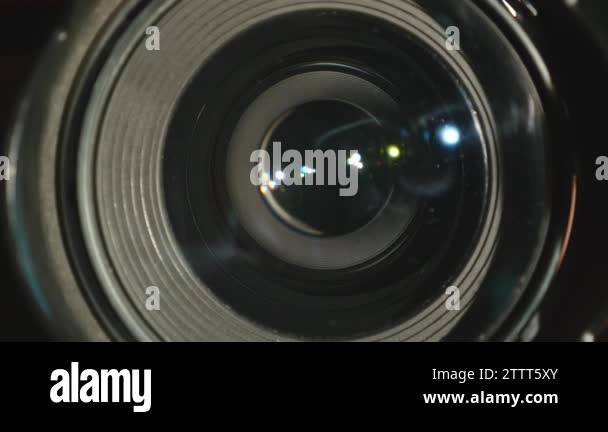 Video camera lens, showing zoom and glare, turns, close up Stock Video ...