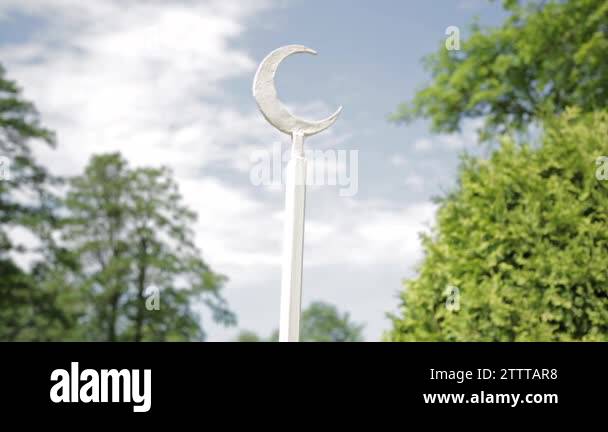 Detail of the iron fence - crescent moon symbol in a garden next to ...