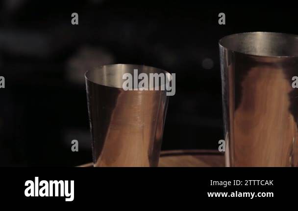 Cocktail shaker and beaker for preparation beverages on bar counter in ...