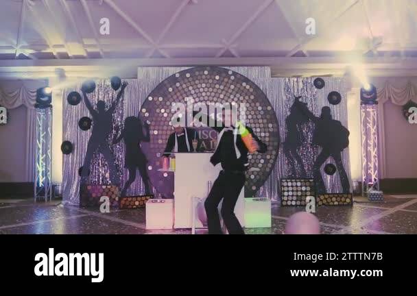 Close up. Profesional show performed by barman juggling one bottle and ...