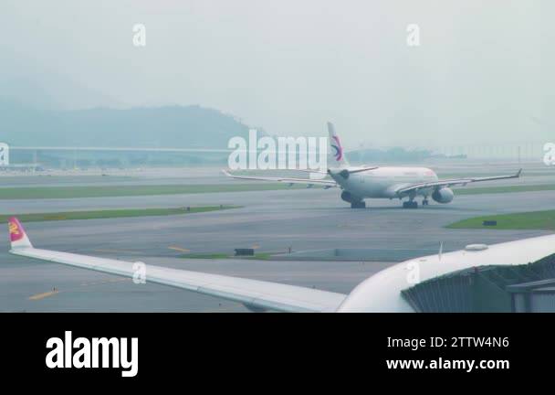 Airplane driving on runway for taking off in airport terminal. Aircraft ...