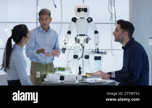 4K Technical design team collaborating on construction of robot in ...