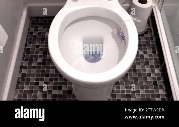 Water level raising and falling in a toilet Stock Video Footage - Alamy