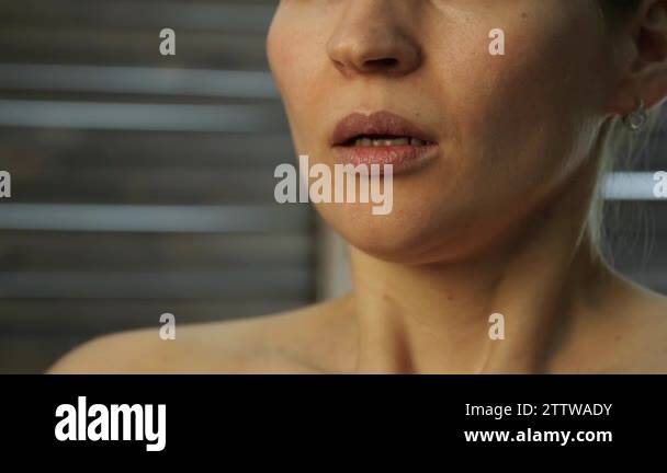 prevention of skin aging, woman performs exercises for a face building ...