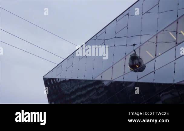 Funicular going up the line with abstract reflection on modern glass ...