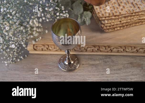 Silver wine cup with matzah, Jewish symbols for the Passover Pesach ...