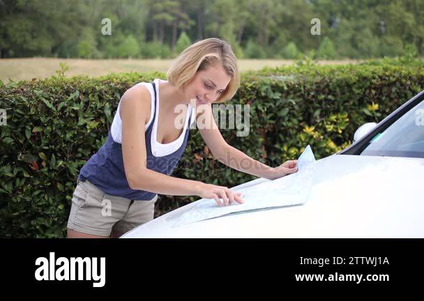 Woman reading a map Stock Videos & Footage - HD and 4K Video Clips - Alamy