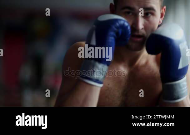Man with Boxing gloves Boxing in front of the camera close up. Close-up ...