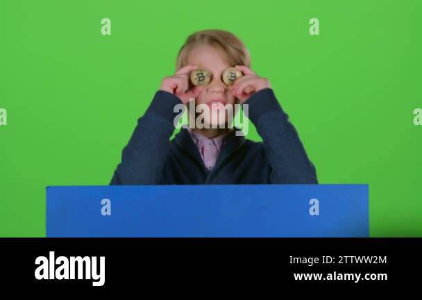 Teen emerges from behind the board with two chips and shows tongue on a ...
