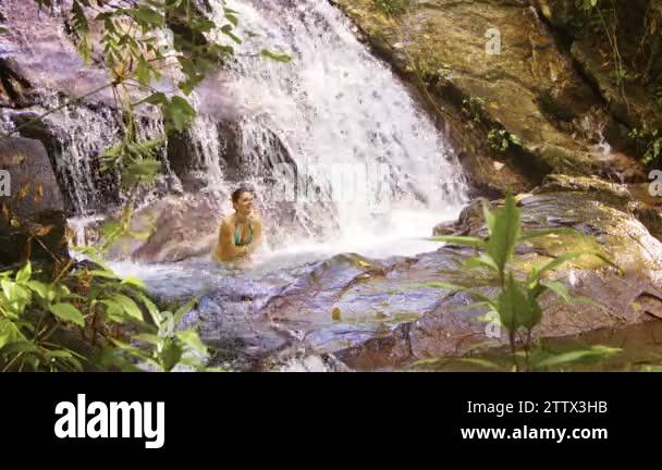 Video 1920x1080 - A woman washing in natural waterfall. Thailand ...