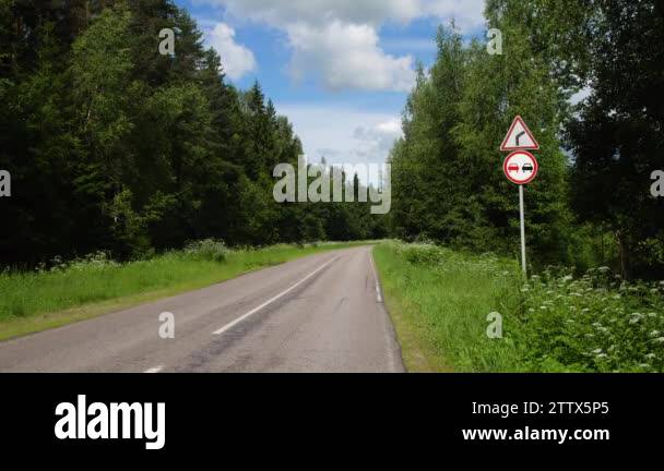 Road sign warning of dangerous right curve and sign no passing Stock ...