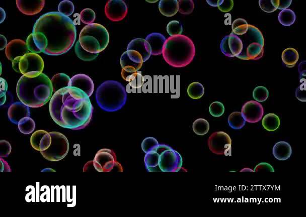Bubbles rise upwards on a black background Stock Video Footage - Alamy