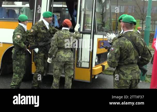 The elite army troop of the Czech Republic is armed into the bus, with ...