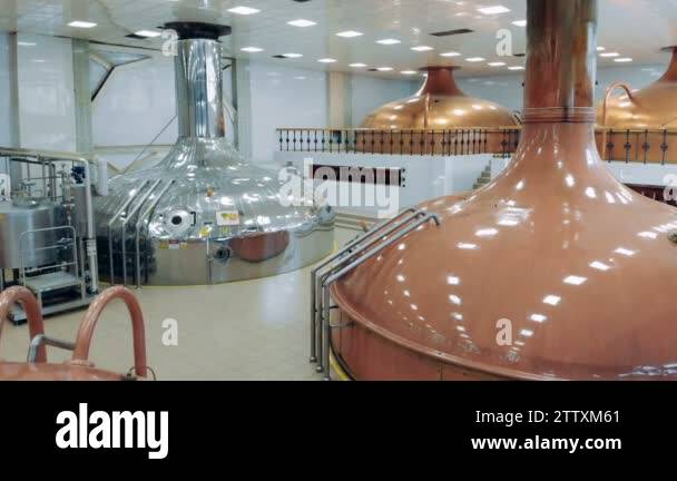 Beer production in a modern facility with metal containers Stock Video ...