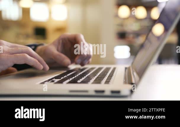 Man looks at email diagram and chart with and typing text on the laptop ...