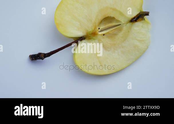 Slice of apple spinning on white background Stock Video Footage - Alamy