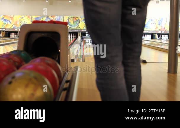 People playing a game of bowling at the small town bowling alley Stock ...