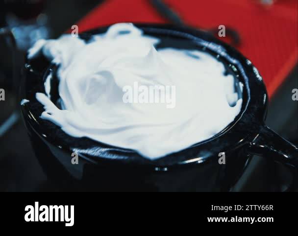 White cream for shaving with sharp razor in barbershop. Professional ...