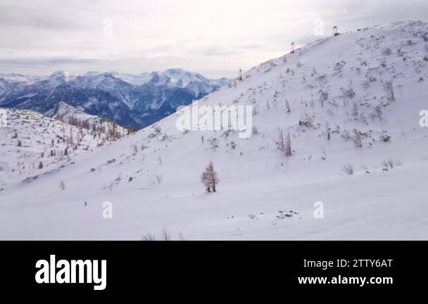 Panorama of the snowy plateau of Feuerkogel mountain with ski lifts ...