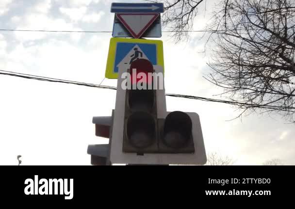 Traffic lights red, yellow, green, green arrow. Sign give way ...