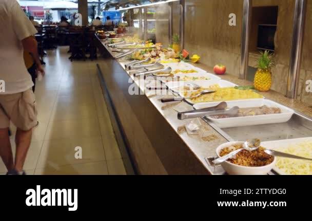 Hot buffet in a restaurant in Brazil with different types of local food ...