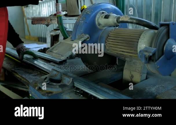 plastic windows. Worker Cutting PVC Profile with Circular Saw.PVC ...
