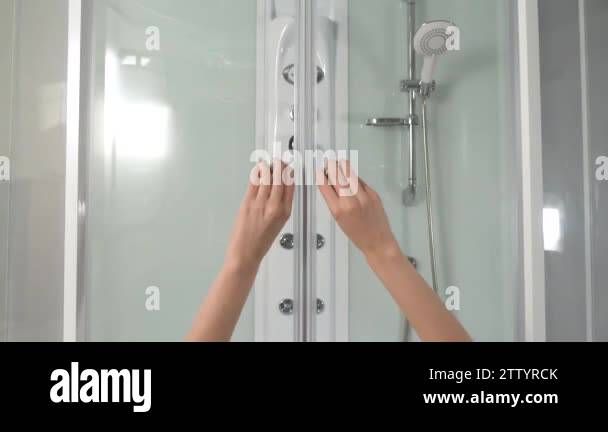 Female hands open sliding doors of shower cabin. Shower cabin. Sliding ...