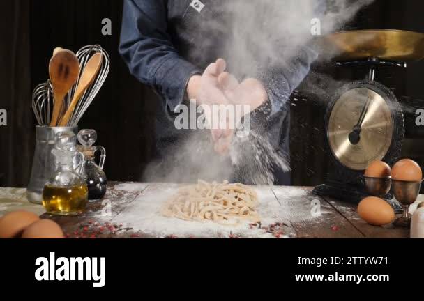 Chef clapping hands with flour while making dough for pizza, pasta ...