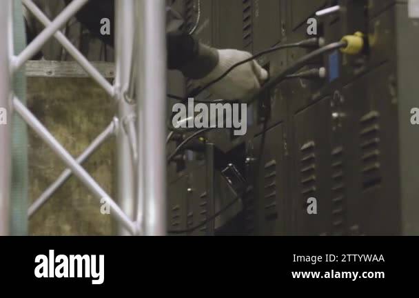 Electrician engineer tests electrical installations and wires on relay ...