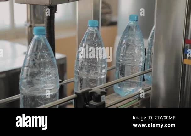 Plastic bottle manufacturing line. Plastic molding bottling factory ...