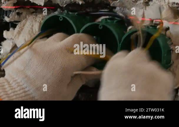 Repair installation of boxes for electrical outlets in the wall on a ...