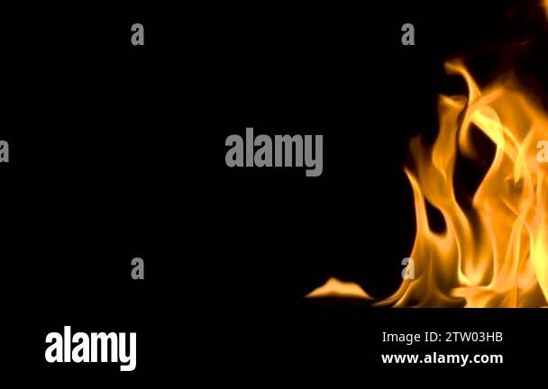 Fire and flames burning on a reflective glass surface, in slow motion ...