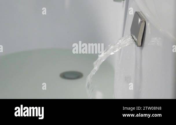 Waterfall faucet. waterfall jet with jacuzzi in action. Empty Swimming ...