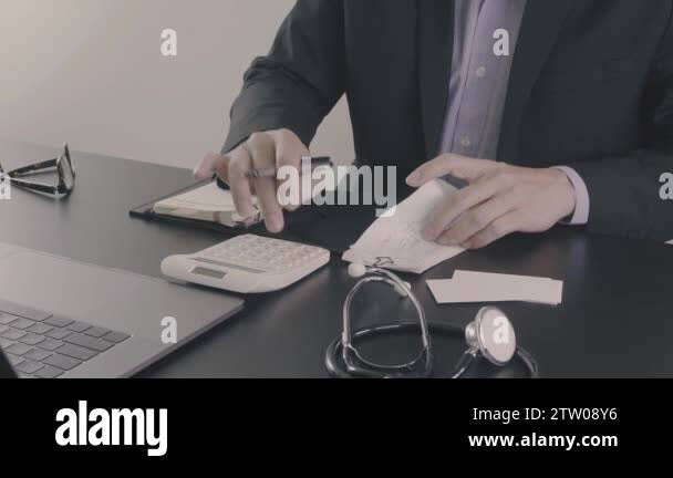 Healthcare costs and fees concept.Hand of smart doctor used a ...