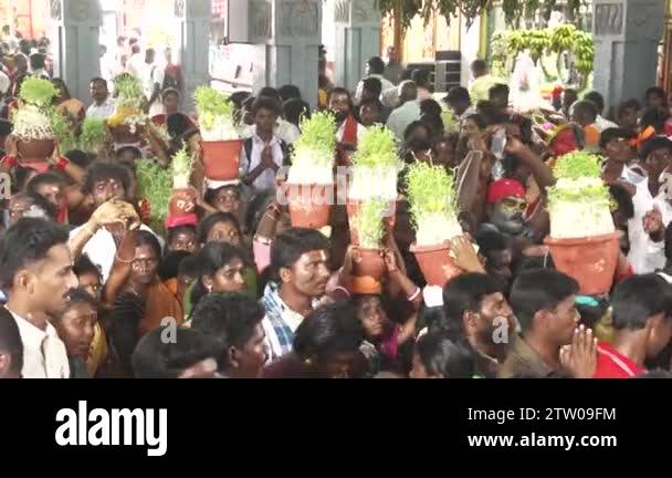 KULASEKHARAPATNAM, INDIA - OCTOBER 20, 2014: Devotees dancing in crowd at Hindu festival in Sri ...