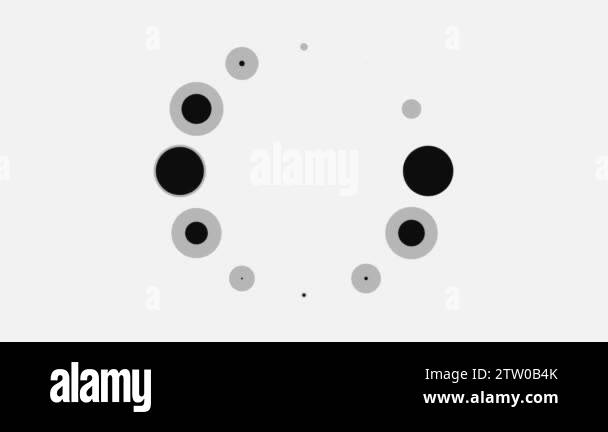Abstract black and grey spinning bubbles in a rotating loading wheel on ...