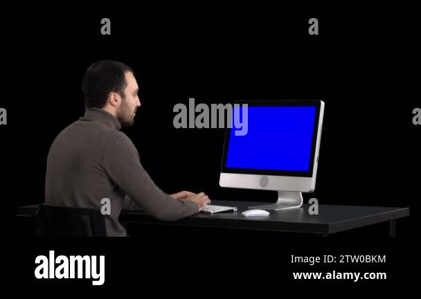 Man typing on the computer, Alpha Channel. Blue Screen Mock-up Display ...