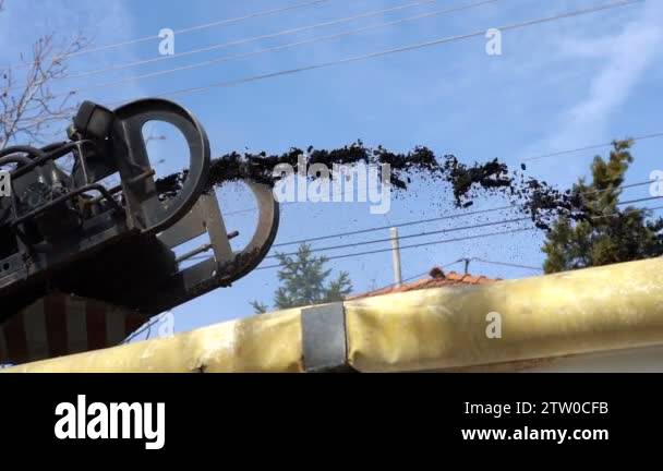 Asphalt Road Milling Machine Unloading Powdered Asphalt - Slow Motion ...