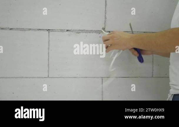 Man fixing wire wall Stock Videos & Footage - HD and 4K Video Clips - Alamy