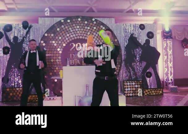 Close up. Profesional show performed by barman in the black clothes ...