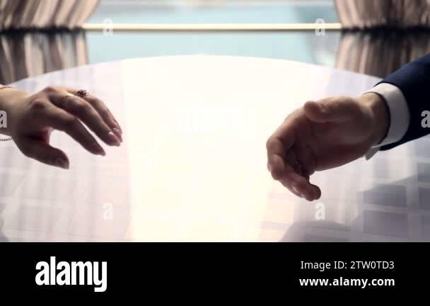 Young people stretch each others hand. A gentle touch of hands between ...