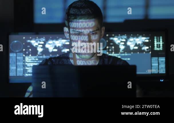 Male Hacker Programmer Working At Computer While Blue Code Characters Reflect On His Face In 5894