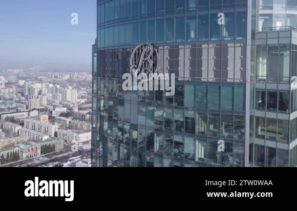 Close up of windows of modern skyscraper. Clouds refelected in modern ...