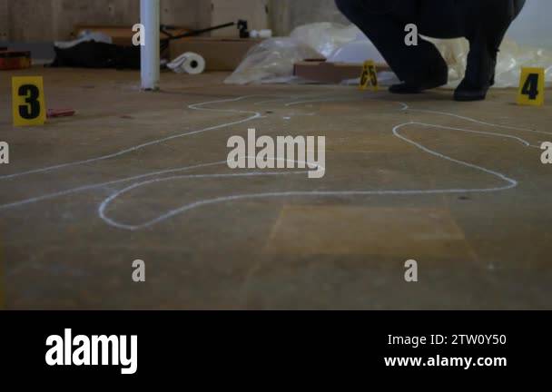 Sliding past a chalk outline at an active police crime scene for a ...