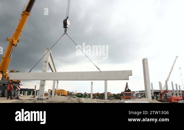 Workers are helping crane on the ground.Workers are helping mobile ...